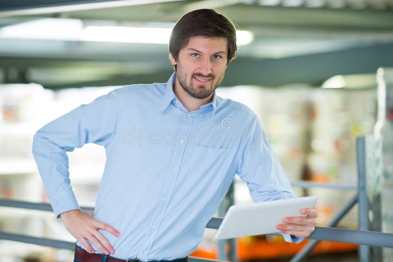 Portrait Smiling Factory Worker Using Tablet in Factory Stock Image ...