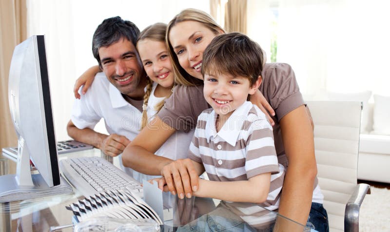 Portrait of a Smiling Family at a Computer Stock Image - Image of ...