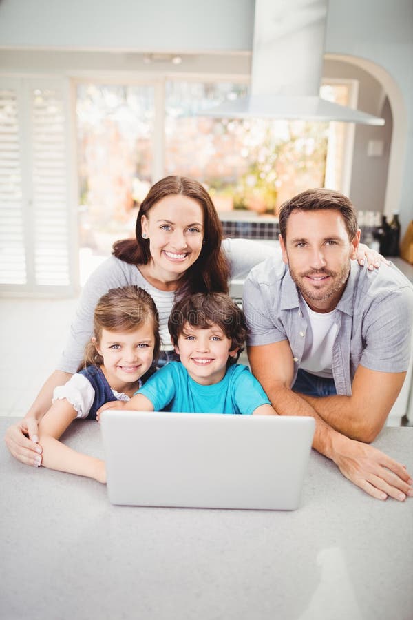Family with Laptop Sitting on Sofa Stock Image - Image of high, angle ...