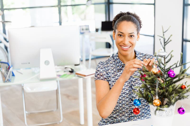 Portrait of Smiling Female Office Worker with Christmas Tree Stock ...