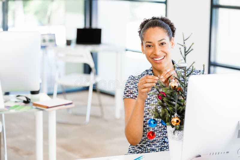 Portrait of Smiling Female Office Worker with Christmas Tree Stock ...