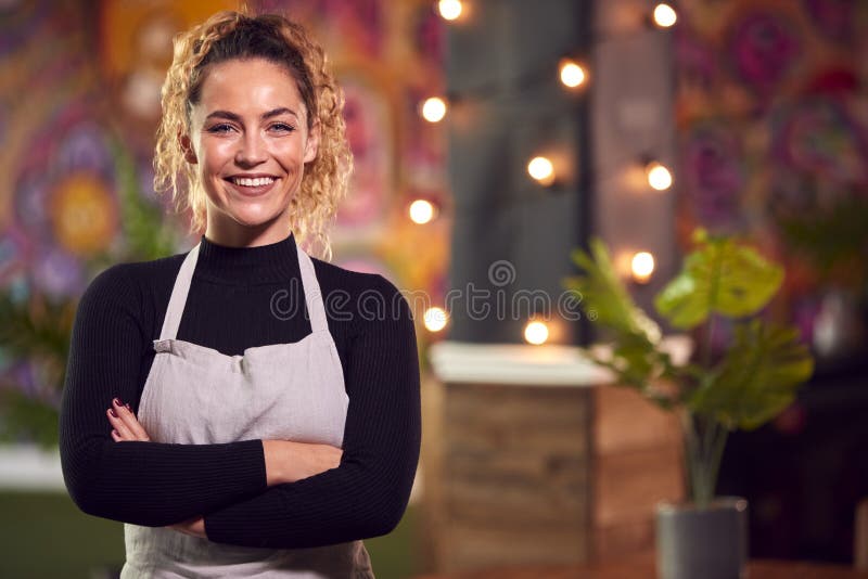 Portrait of Smiling Female Server Working Night Shift in Bar Restaurant ...
