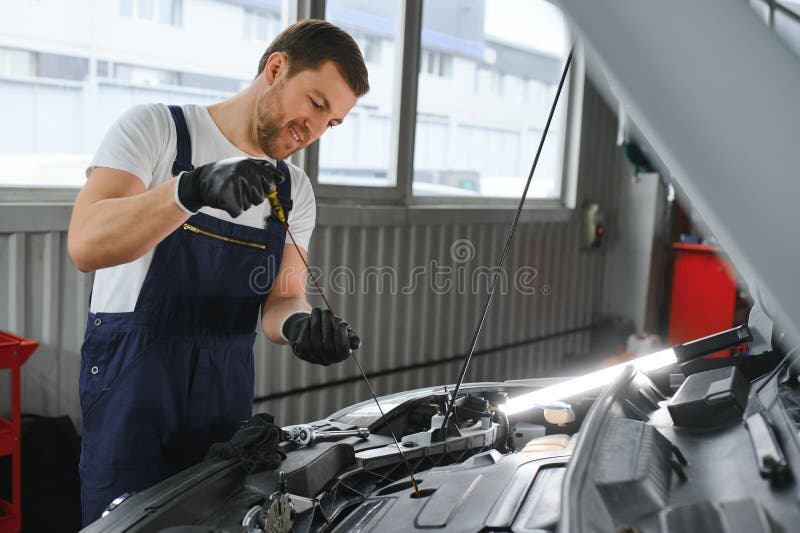 Portrait of a Smiling Fixing a Car Engine in His Garage Stock Photo ...