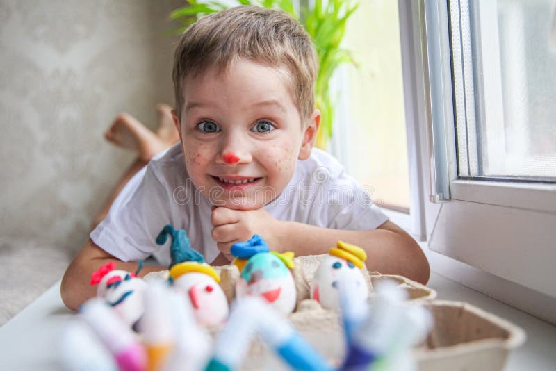 Portrait of a Smiling Four Year Old Boy with a Painted Face Lying on ...