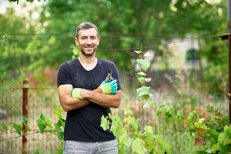Portrait of Smiling Gardener Standing in His Garden Stock Photo - Image ...