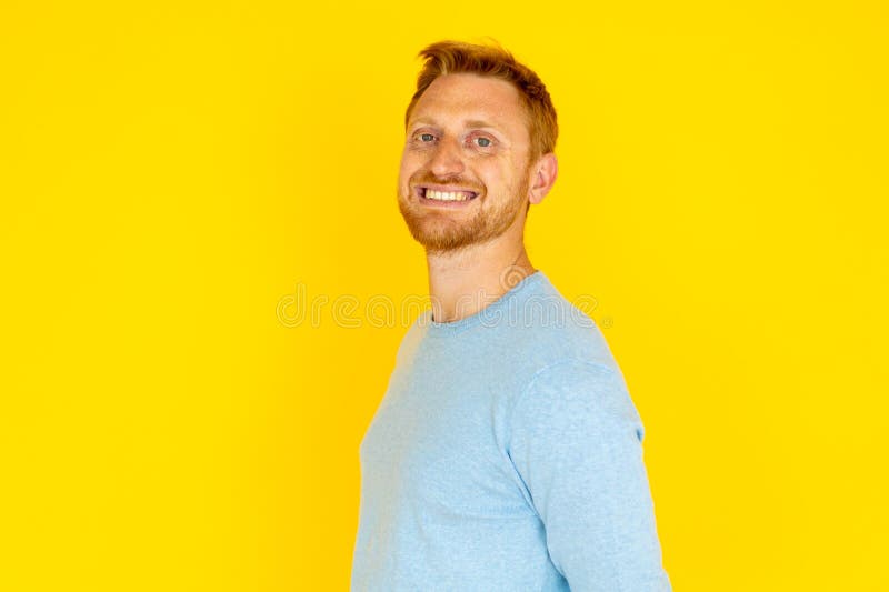 Portrait of Smiling Ginger Man with Beard on Yellow Background Stock ...