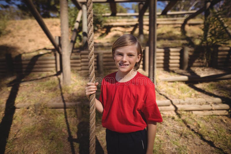 Portrait of Smiling Girl Holding Rope during Obstacle Course Stock ...
