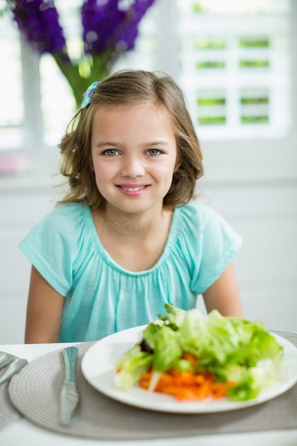 Portrait of Smiling Girl Sitting at Dining Table Stock Image - Image of ...
