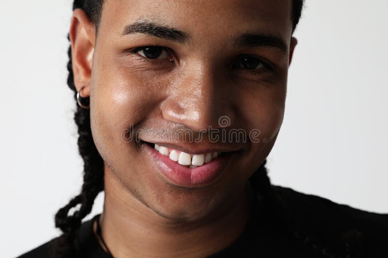 Portrait Of Handsome Dark Skinned Young Man Wearing Trendy Hat
