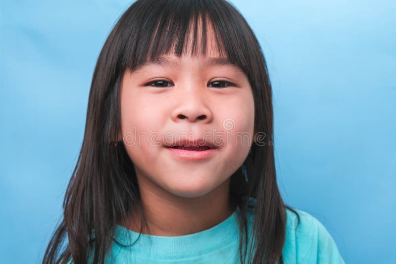 Portrait of a Smiling Little Girl Looking at the Camera. Close Up of ... Portrait of a Smiling Little Girl Looking at the Camera. Close Up of ...