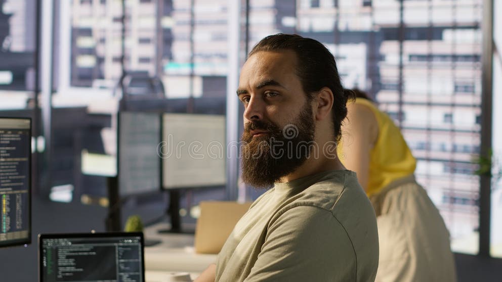 Portrait Of Smiling Machine Learning Infrastructure Engineer Developing Algorithms Stock Image