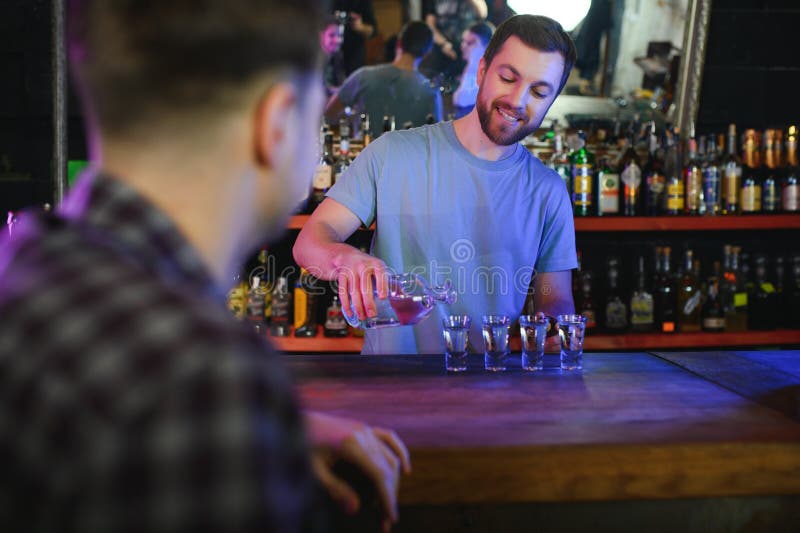 Portrait of Smiling Male Bar Owner Standing Behind Counter Stock Image ... Portrait of Smiling Male Bar Owner Standing Behind Counter Stock Image ...