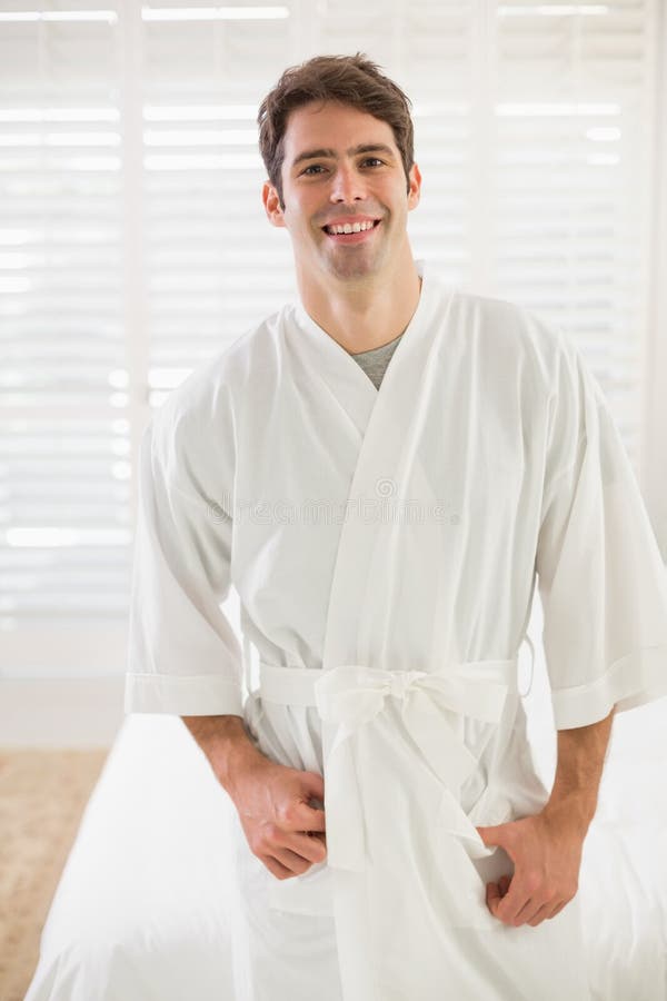 Portrait of Smiling Man in Bathrobe in Bedroom Stock Image - Image of ...