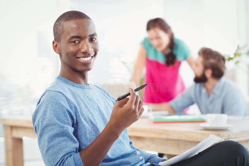 Portrait of Smiling Man Holding Pen Stock Photo - Image of elegant ...