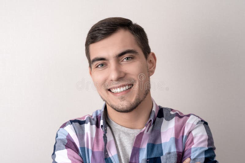 Portrait of Smiling Man on Light Background Stock Photo - Image of ...