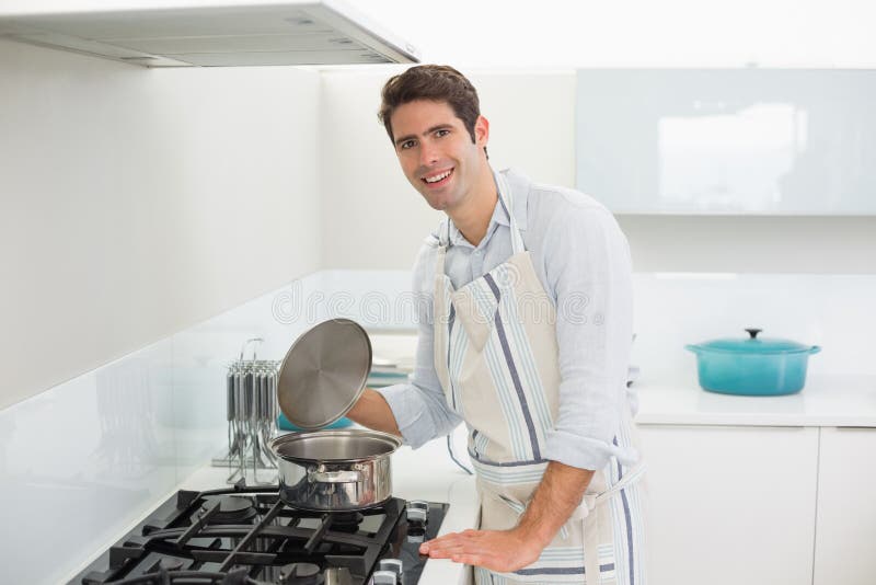 Portrait of a Smiling Man Preparing Food in Kitchen Stock Image - Image ...