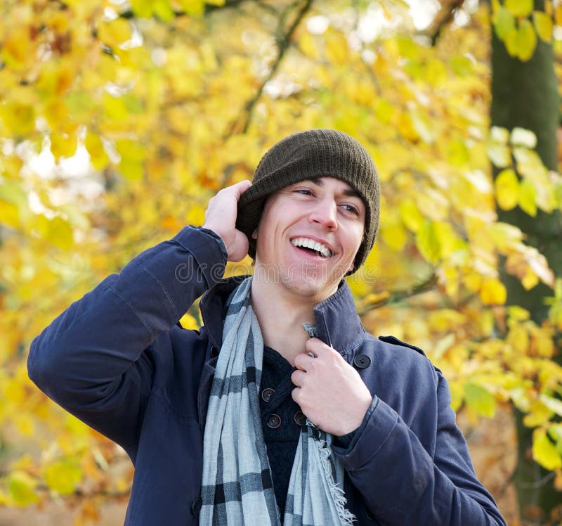 Portrait of a Smiling Man Standing Outdoors with Hat Stock Image ...
