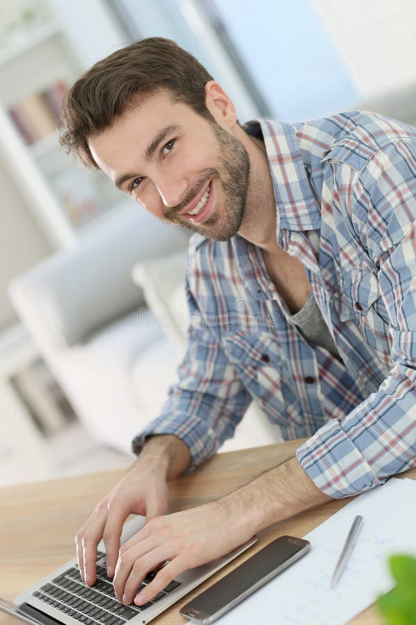 Portrait of a Smiling Man Teleworking Stock Image - Image of small ...