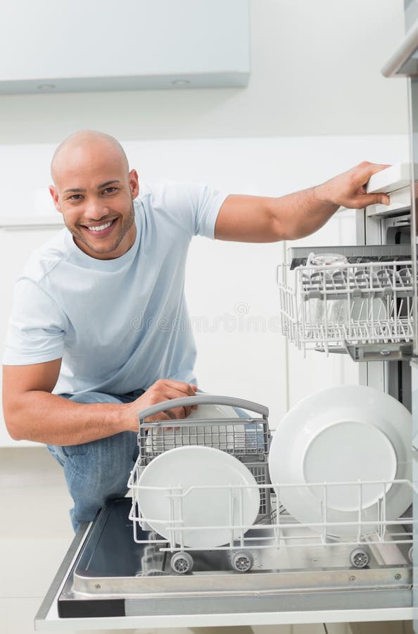 Portrait of Smiling Man Using Dish Washer in Kitchen Stock Image ...