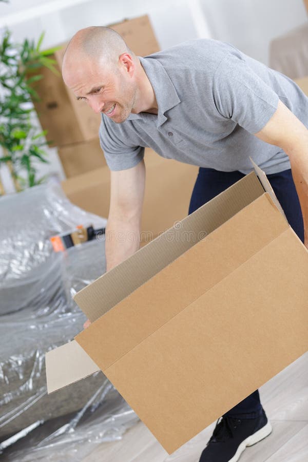 Portrait Smiling Mature Man Carrying Box Stock Photo - Image of smiling ...