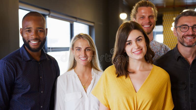 Portrait of Smiling Multi-Cultural Business Team in Modern Open Plan ...