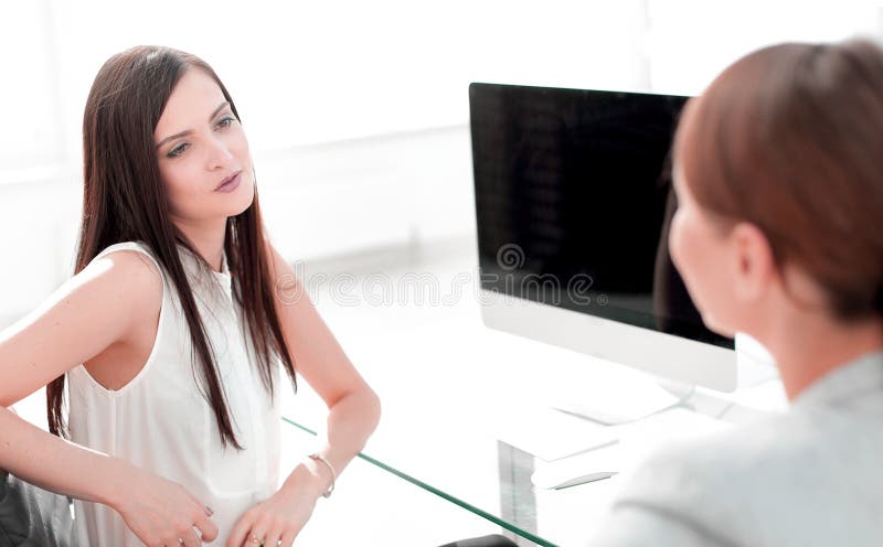 Portrait of Smiling Office Worker in Front of Desktop Stock Photo ...