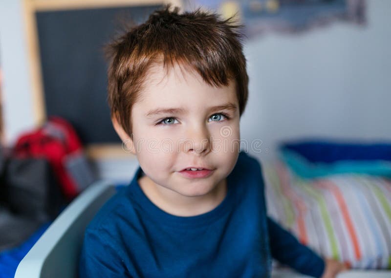 Portrait of a Smiling, Pretty Boy of Several Years in the Children Room ...