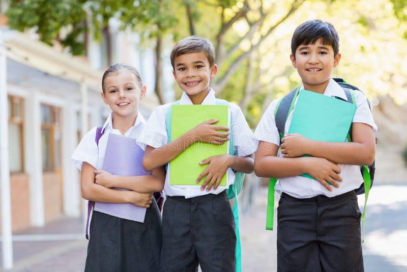 Portrait of Smiling School Kids Standing in Campus Stock Image - Image ...