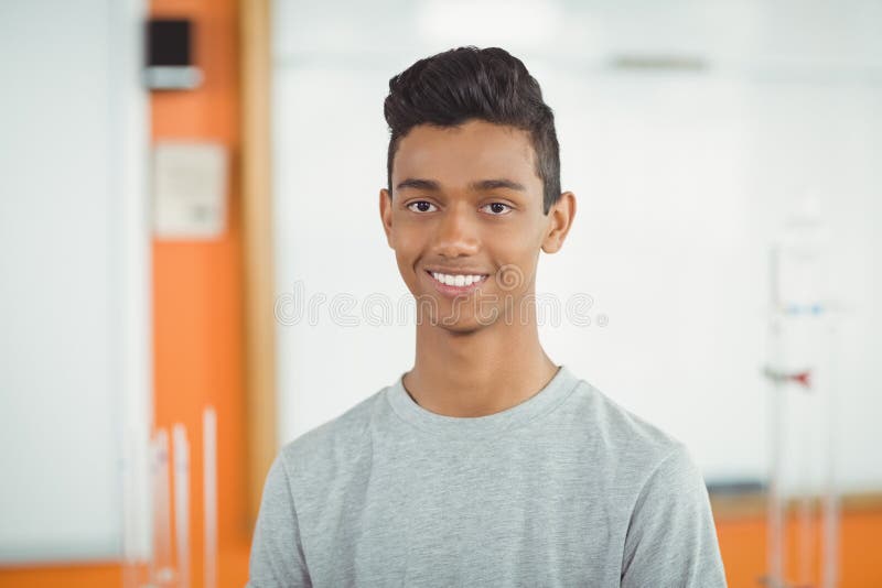 Portrait of Smiling Schoolboy in Classroom Stock Image - Image of ...