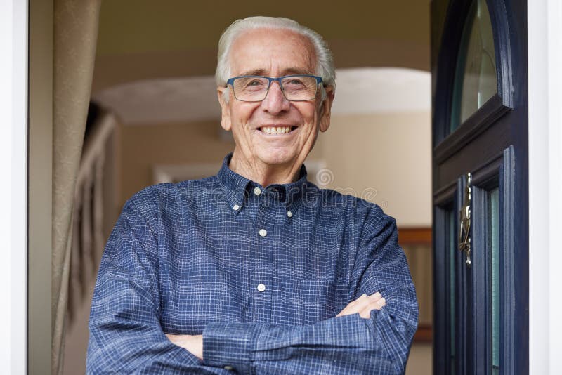 Portrait of Smiling Senior Man Standing at Open Front Door of House ...