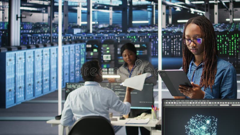 Portrait of Smiling Server Room Engineer Using Device To Interpret AI Data Stock Video - Video ...