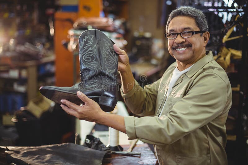 Portrait of Smiling Shoemaker Holding a Leather Boot Stock Image ...