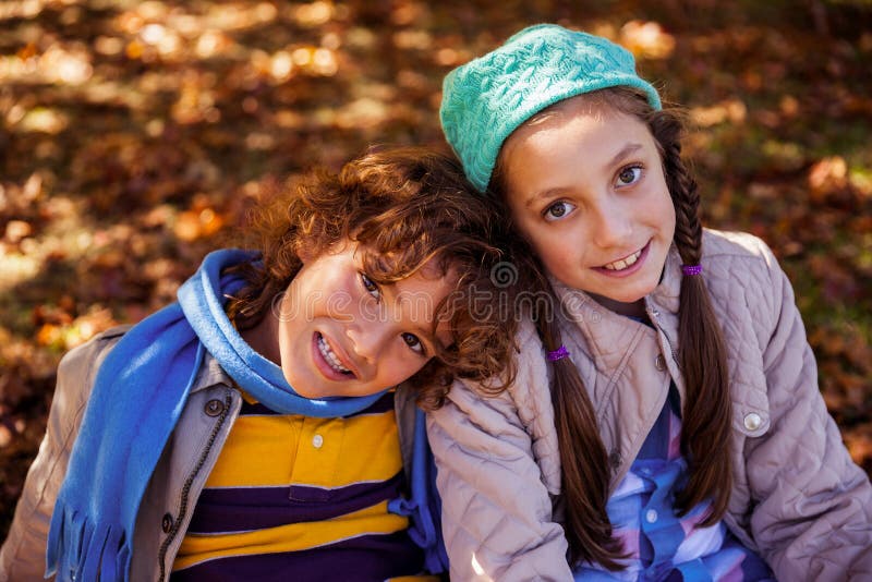 Portrait of Smiling Siblings Stock Image - Image of friend, park: 76127157