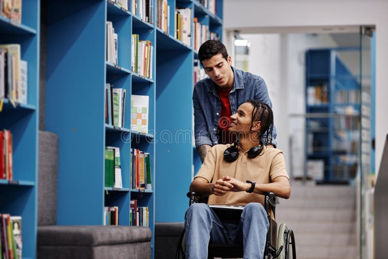 Smiling Student with Disability Using Wheelchair in Library Stock Photo ...