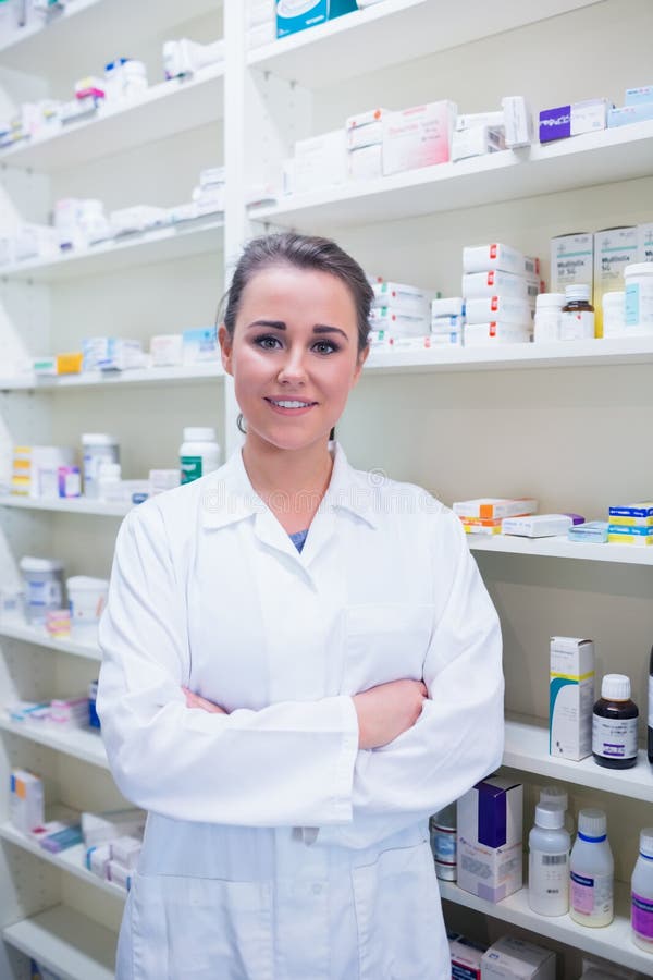 Portrait of a Smiling Student in Lab Coat with Arms Crossed Stock Photo ...