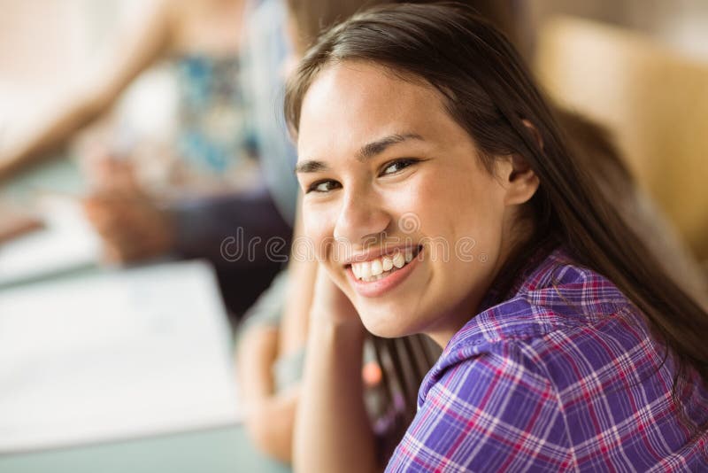 Portrait of a Smiling Student Revising Stock Photo - Image of hands ...