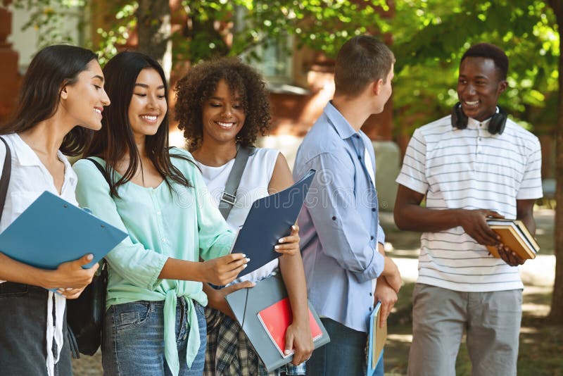 Portrait of Smiling Students Standing Outdoors at Campus Courtyard ...