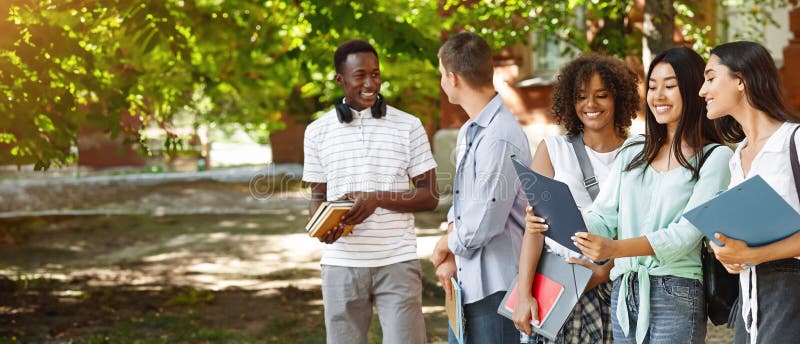 Portrait of Smiling Students Standing Outdoors at Campus Courtyard ...