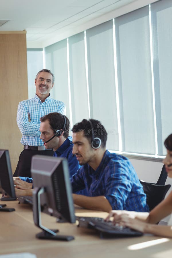 Portrait of Smiling Supervisor with Business Team at Call Center Stock ...
