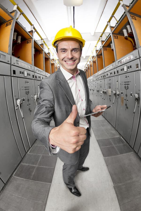 Portrait of Smiling Supervisor with Tablet PC Gesturing Thumbs Up in ...