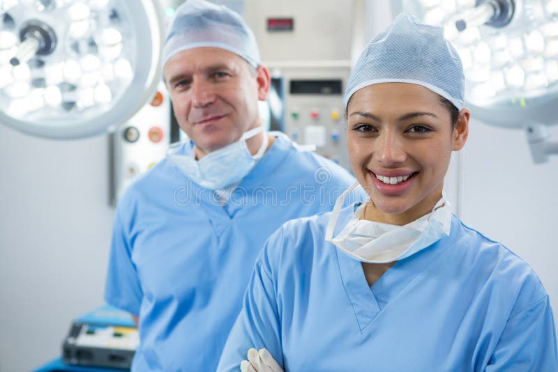 Smiling Surgeons Working Together on Tablet Stock Photo - Image of ...