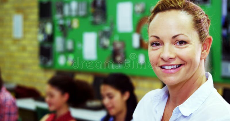 Portrait of Smiling Teacher Taking Computer Class of Students Stock ...