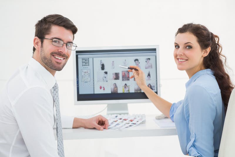 Portrait of Smiling Teamwork Using Computer Stock Photo - Image of male ...