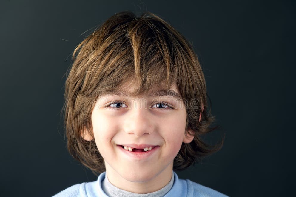 Portrait of a Smiling Toothless Boy Stock Photo - Image of posing ...