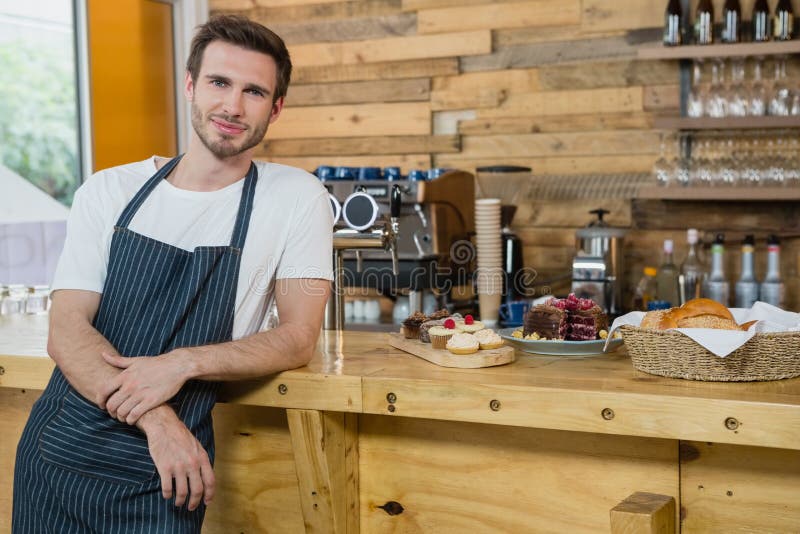 Waiter Leaning Against Counter Stock Photo - Image of happy, lifestyle ...