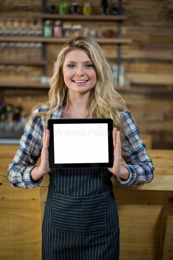 Portrait of Smiling Waitress Showing Digital Tablet Stock Image - Image ...