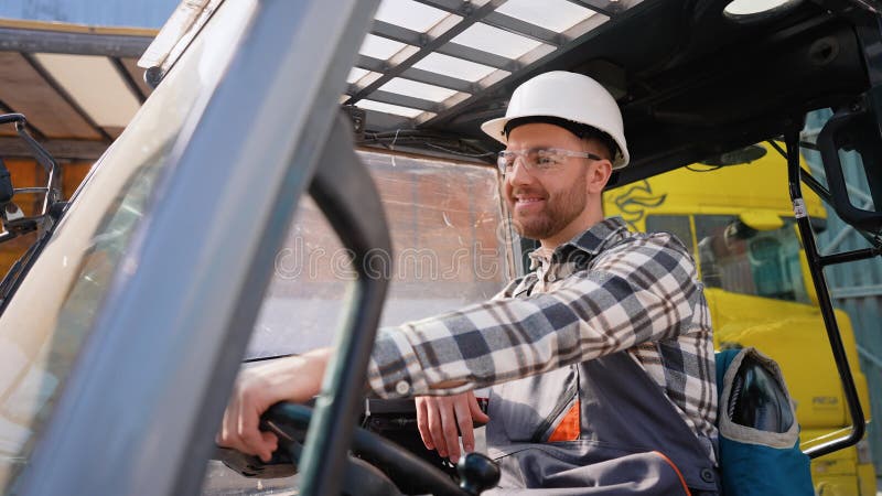 Portrait of Smiling Warehouse Worker Operating a Forklift Loader Stock ...