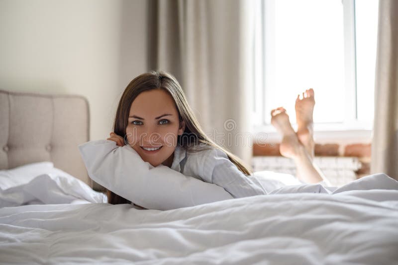 Portrait of Smiling Woman in Bed Lying on Her Stomach Stock Image ... Portrait of Smiling Woman in Bed Lying on Her Stomach Stock Image ...