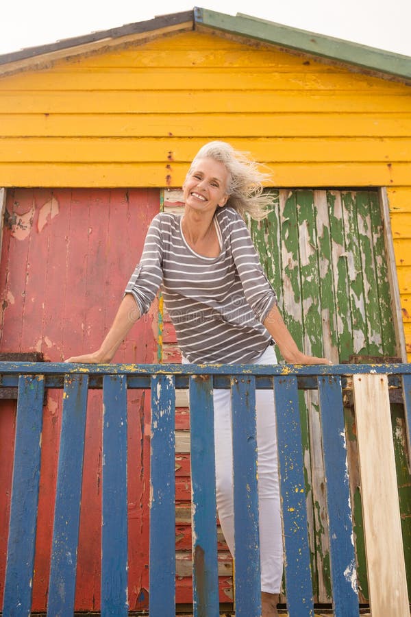 Portrait of Smiling Woman Leaning on Railing Stock Photo - Image of ...