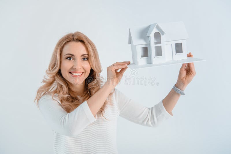 Portrait of Smiling Woman Showing House Model Stock Image - Image of ...